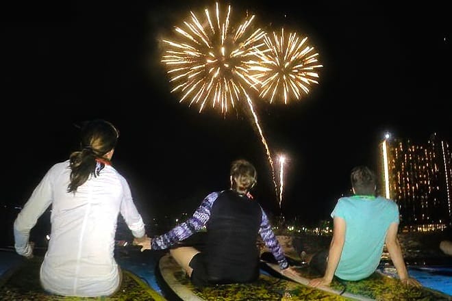 Nighttime Paddleboard under Fireworks — Honolulu