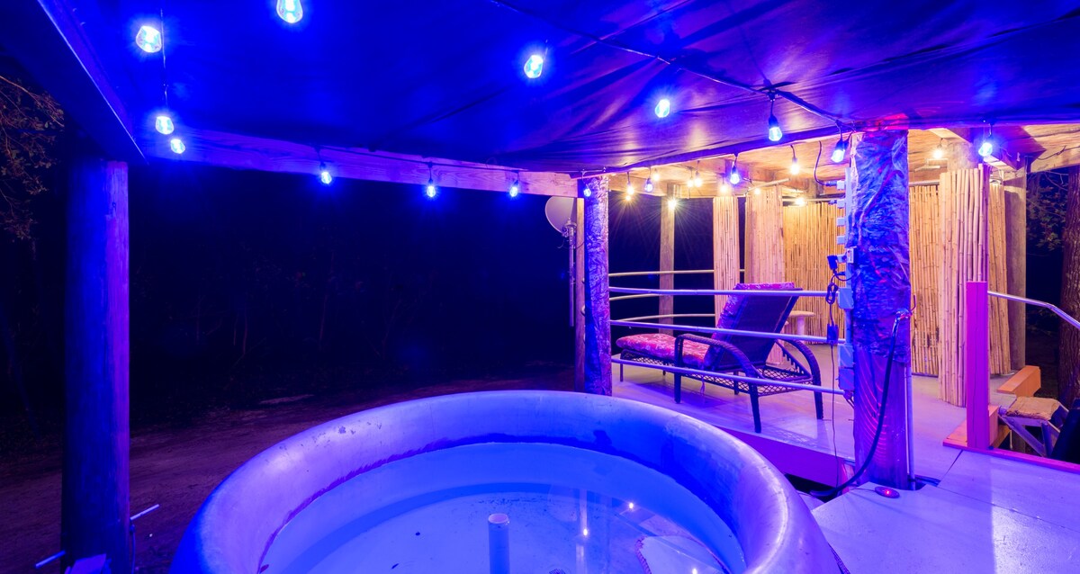 A cozy tub at night located in the upper deck