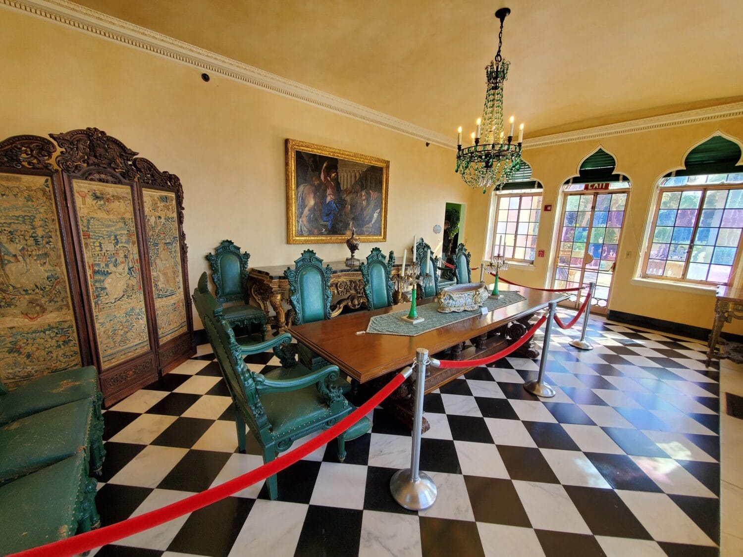 A dining room with ornate furnishings.