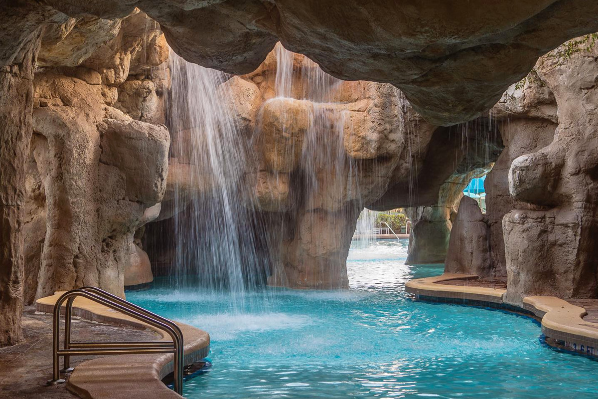 A rocky mermaid cave in the pool.