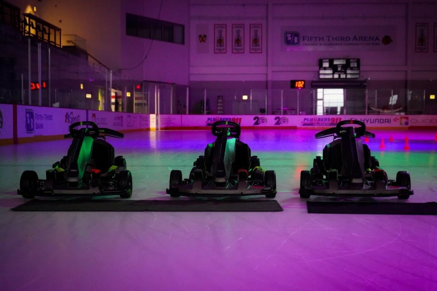 A trio of go karts on ice.