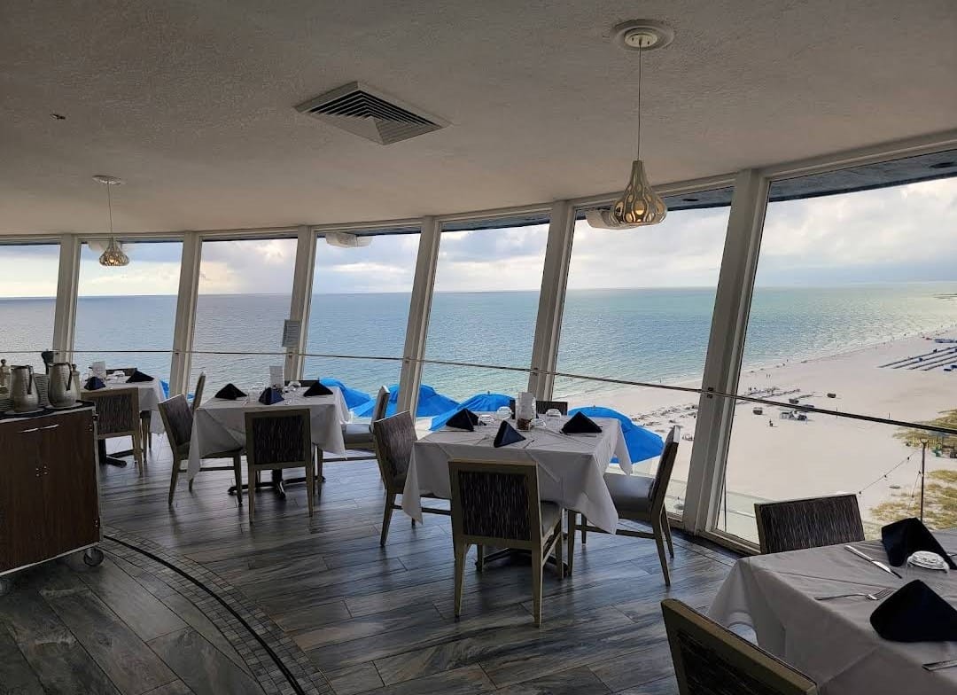 A view of the inside overlooking a stunning beach.