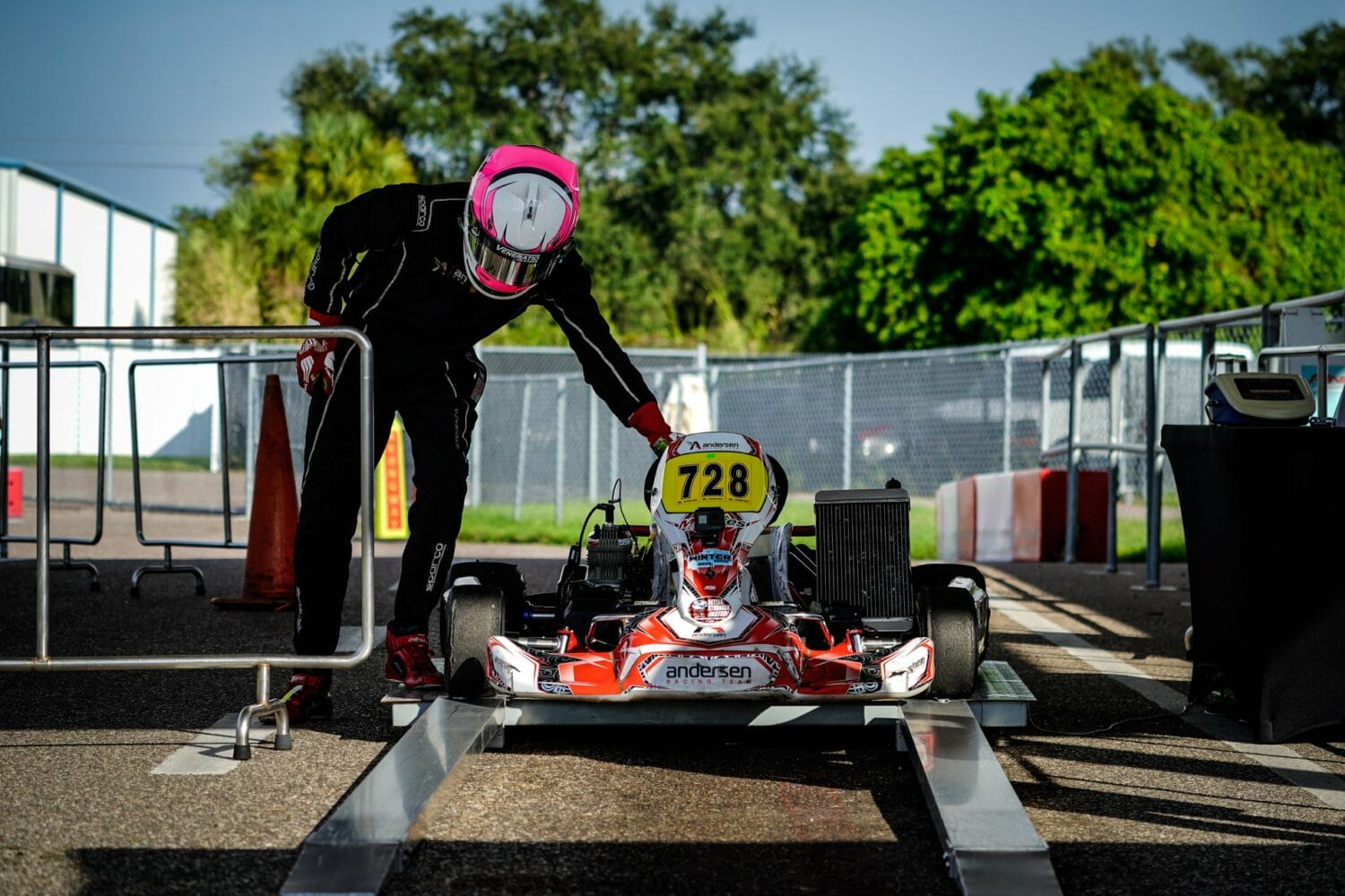 An image of a rider with gear with his go-kart