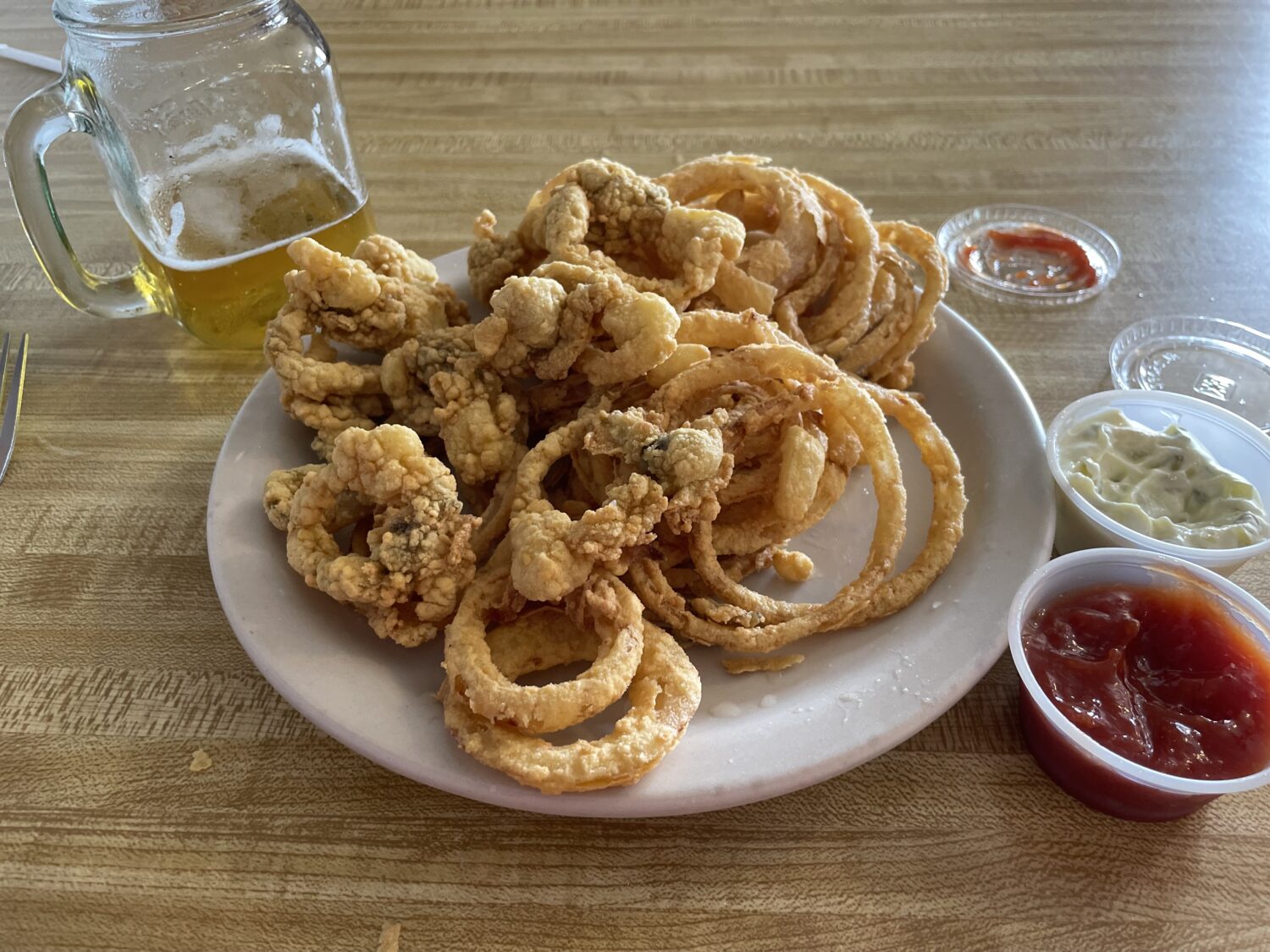 Clam strips piled high with onion rings