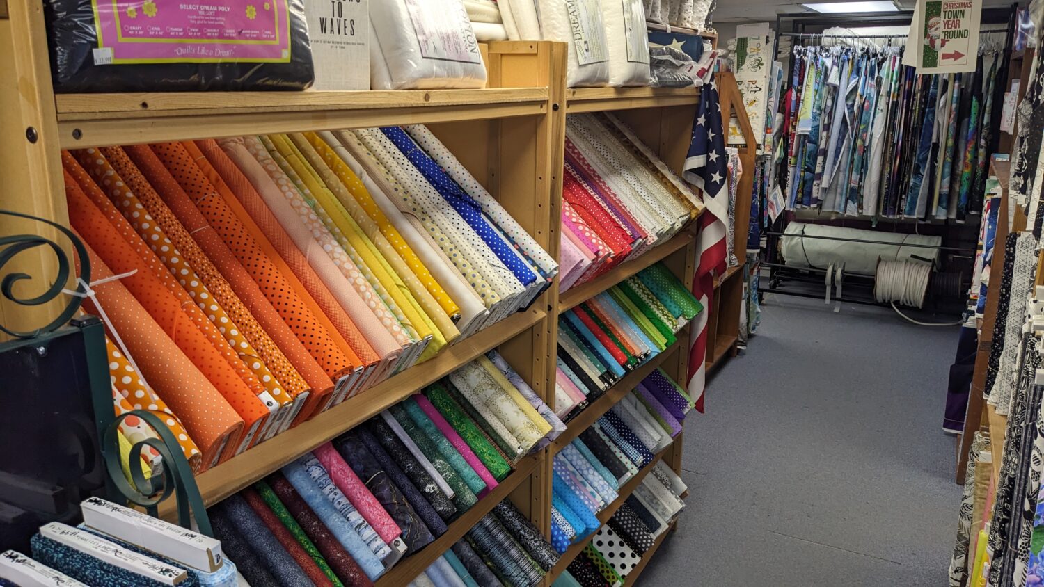 Shelves full of colorful printed fabrics
