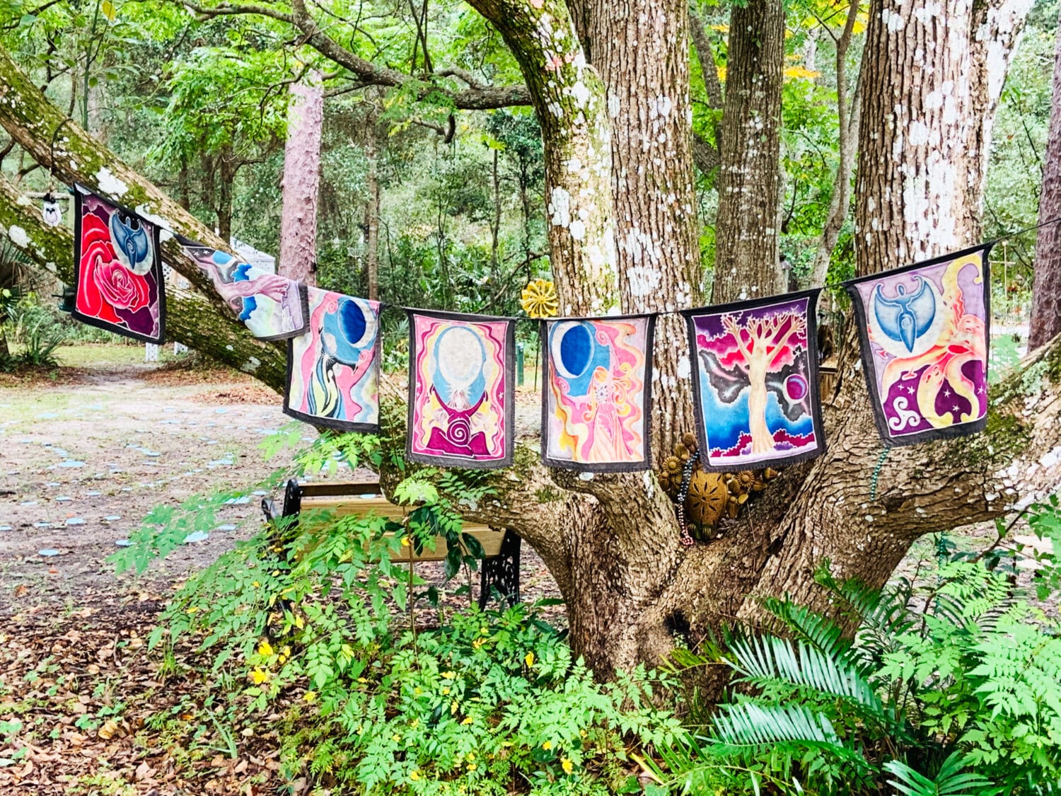 Some decorative tapestries hanging int he tress