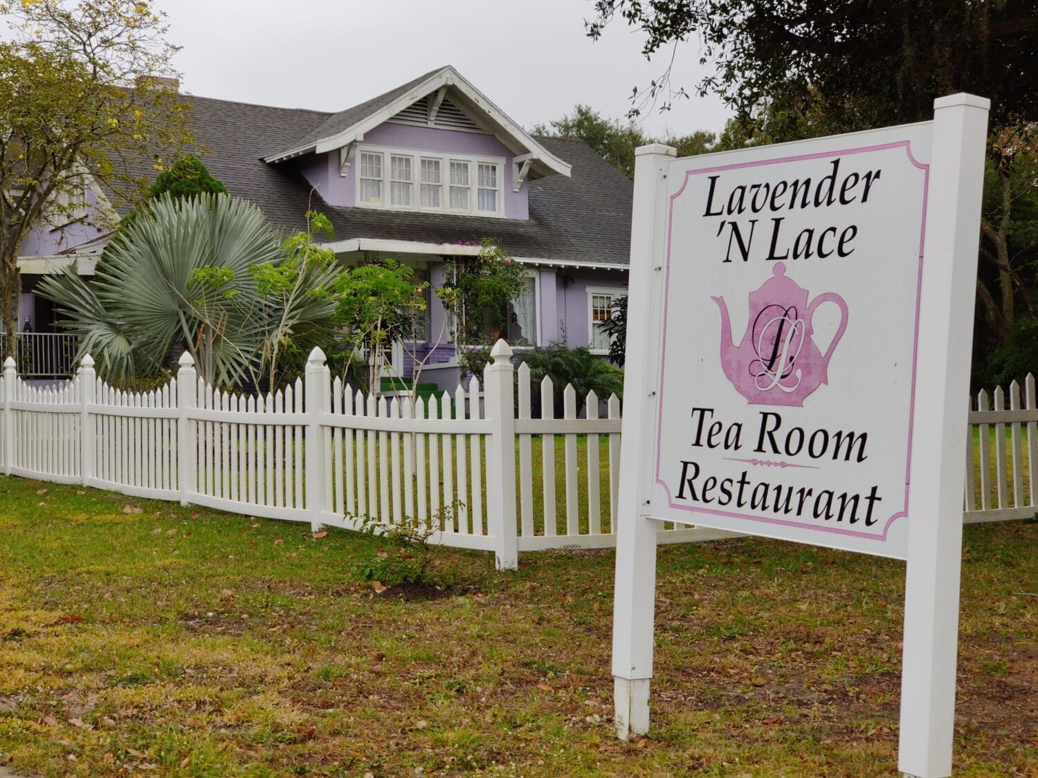 The exterior and sign of the Lavender 'n Lace Tearoom.