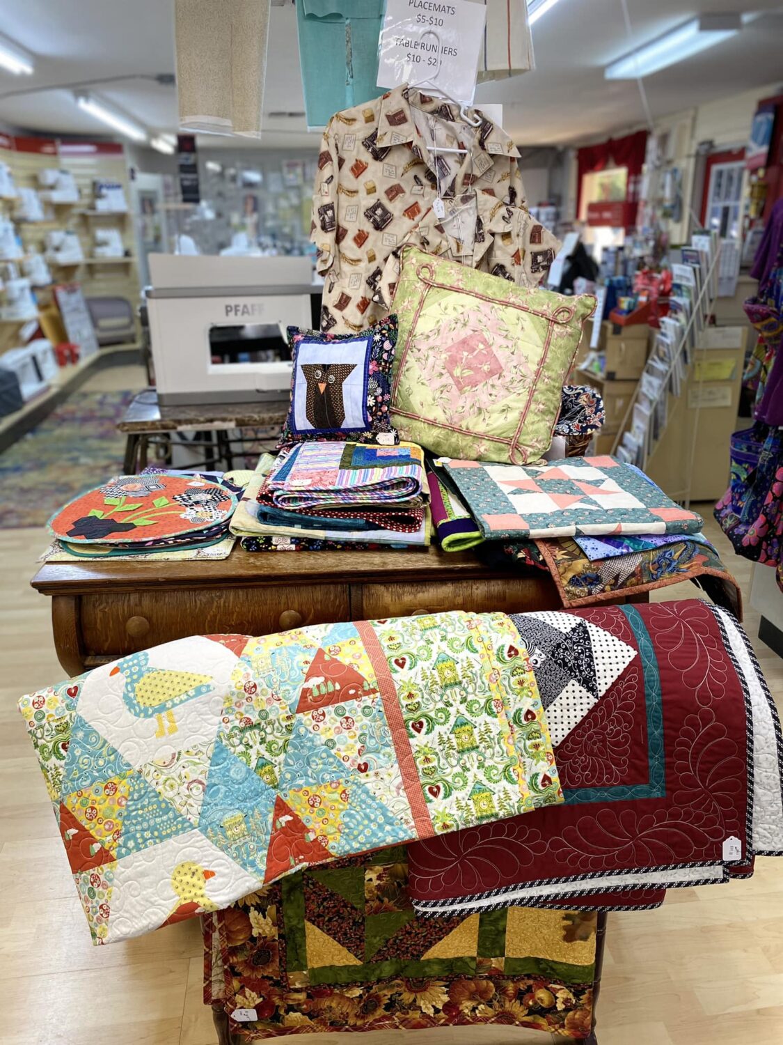 Various quilts and fabrics products.