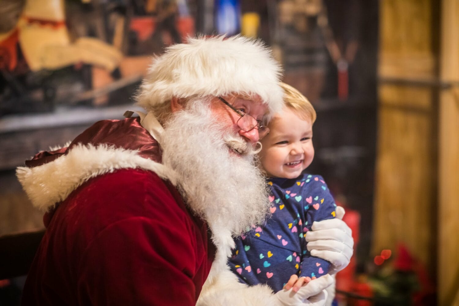 a baby with santa claus