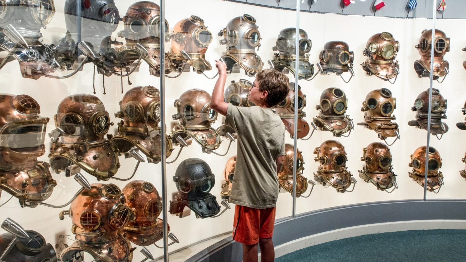 A boy admiring the displays at History of Diving Museum