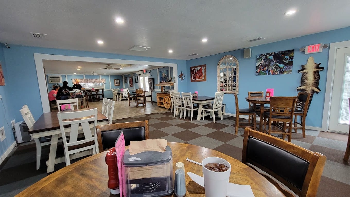 a bright and spacious interior of a seafood restaurant with a casual coastal decor and inviting atmosphere