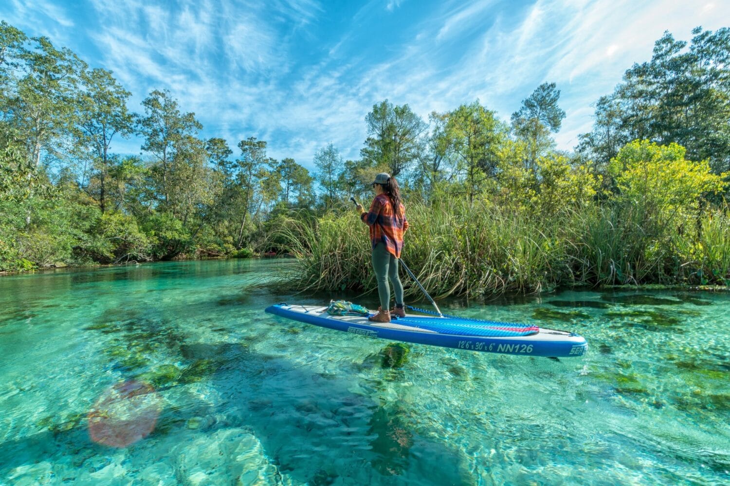 A girl kayaking in the crystal clear waters of Weeki Wachee Springs in Spring Hill