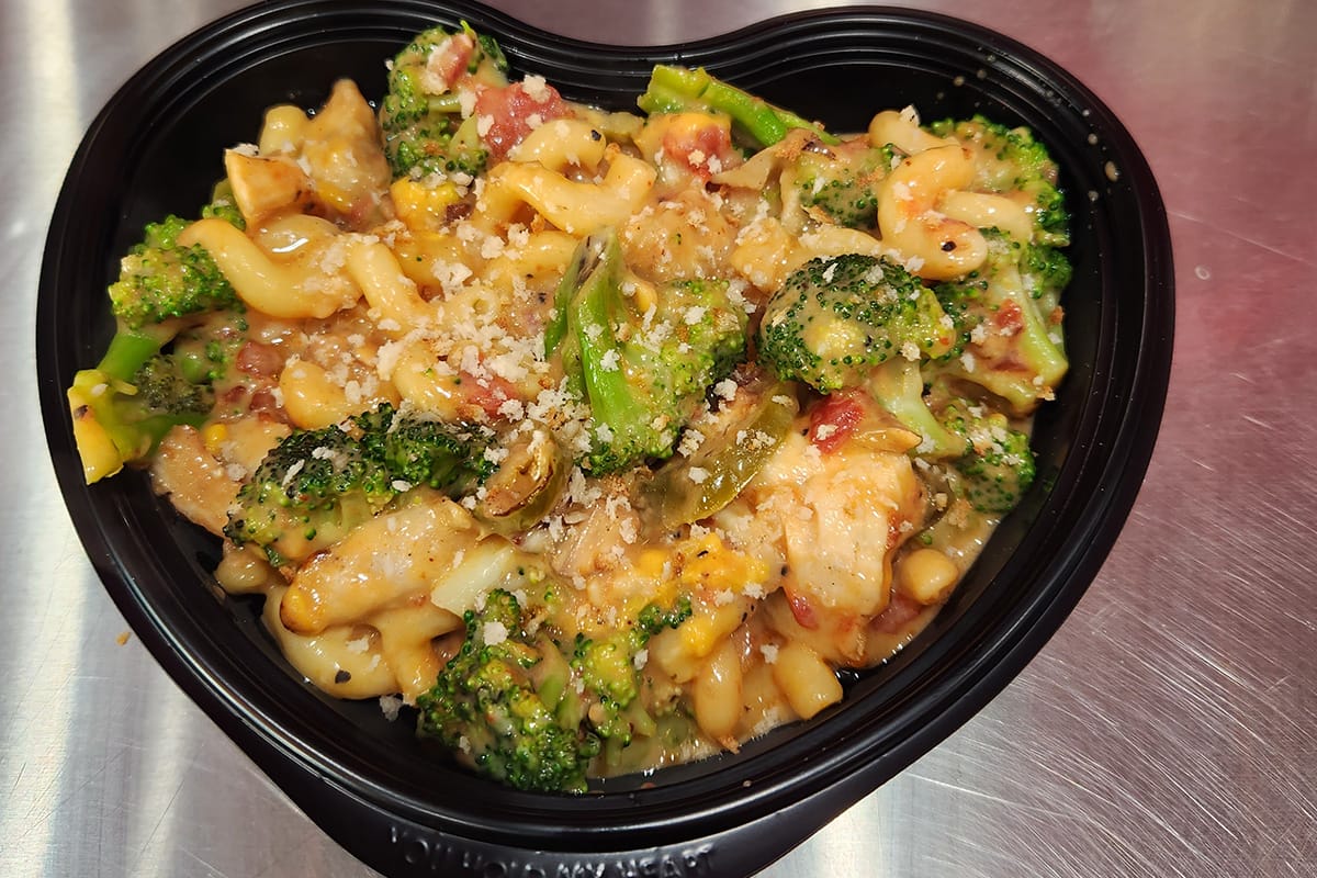 A heary bowl of Mac & Cheese mixed with veggies