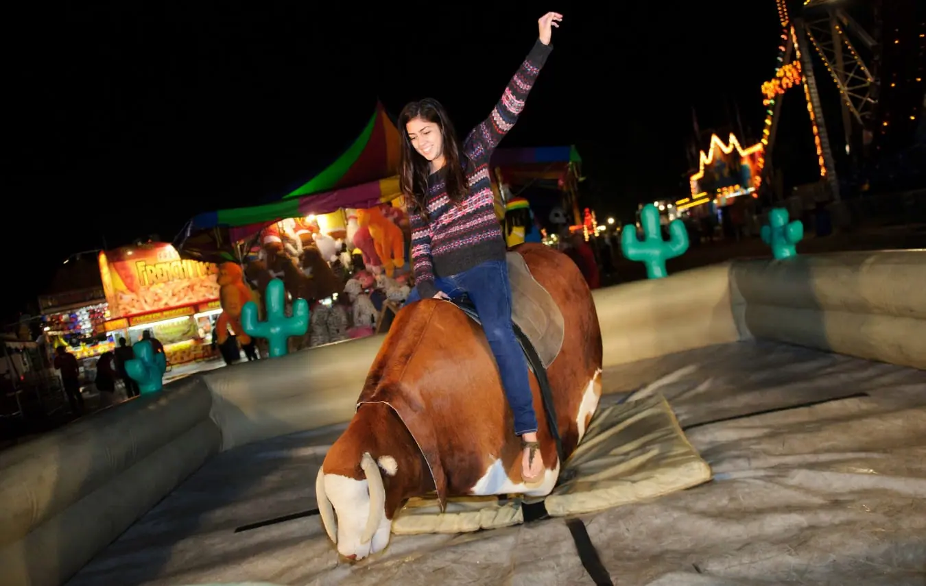 a lady enjoying a rodeo ride