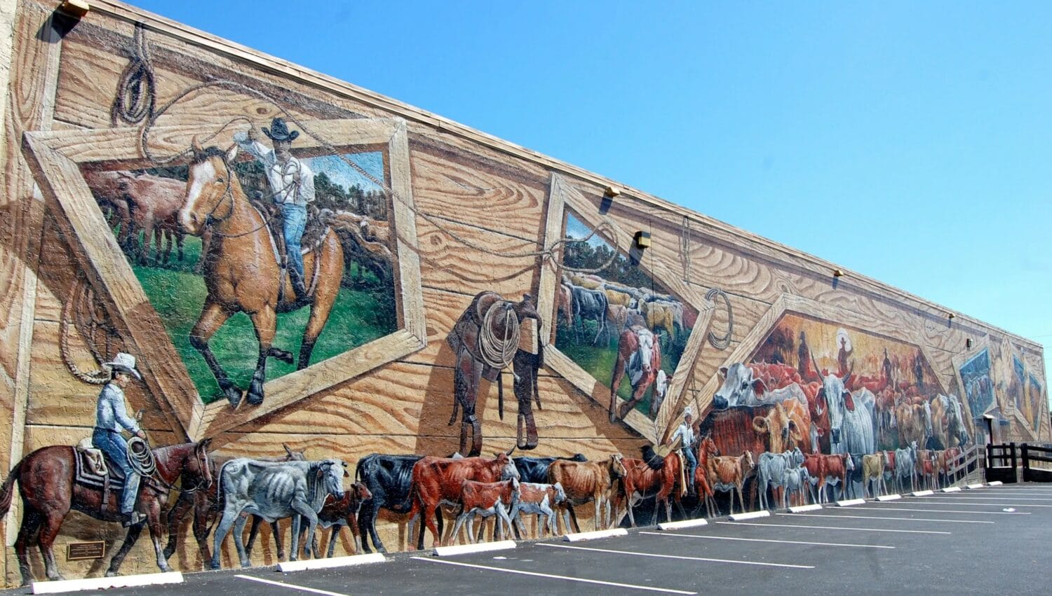 A picture cracker trail cattle mural found in lake placid