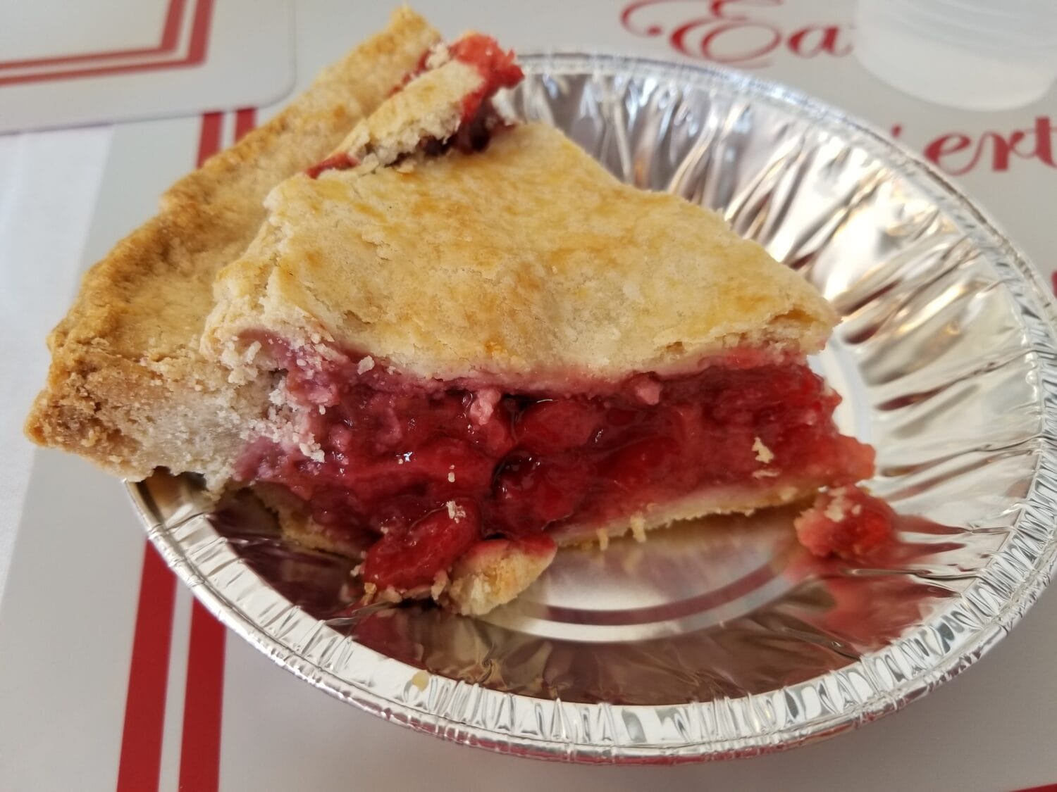 a slice from a fruit pie with thick filling