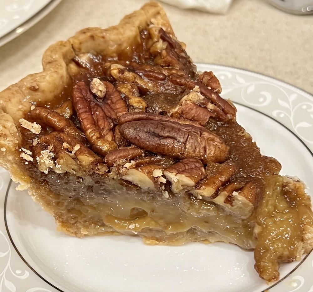 a slice of pecan pie served on a plate