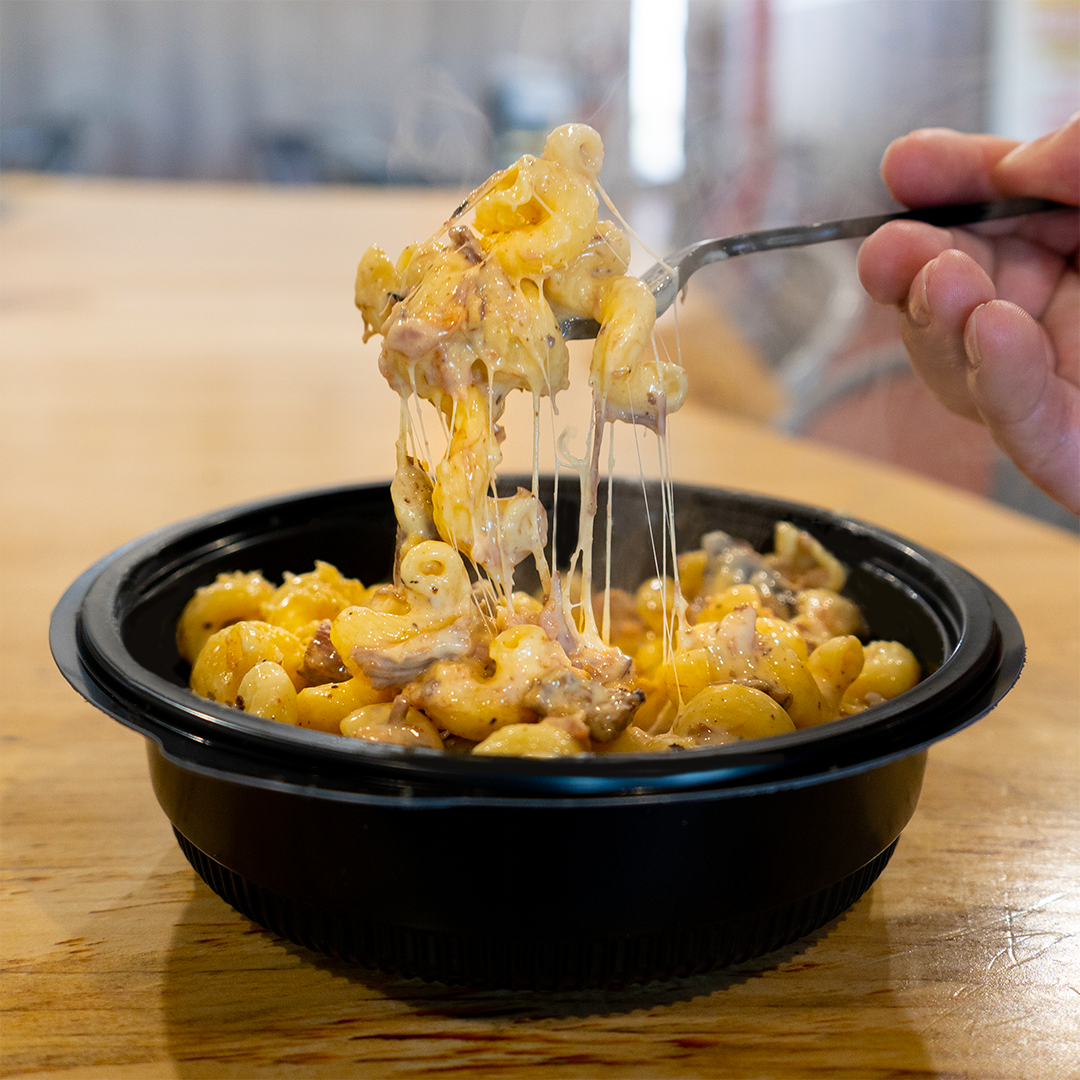 a steaming bowl of mac and cheese