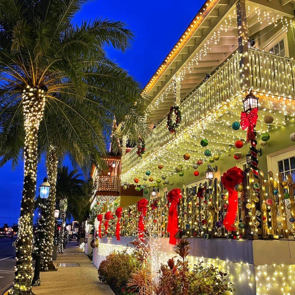 A stunning building covered with holiday lights and Christmas decors