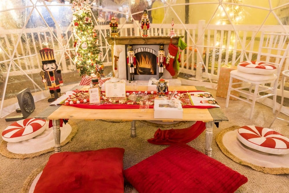 A table set up inside a Snow Globe in Dickens Village