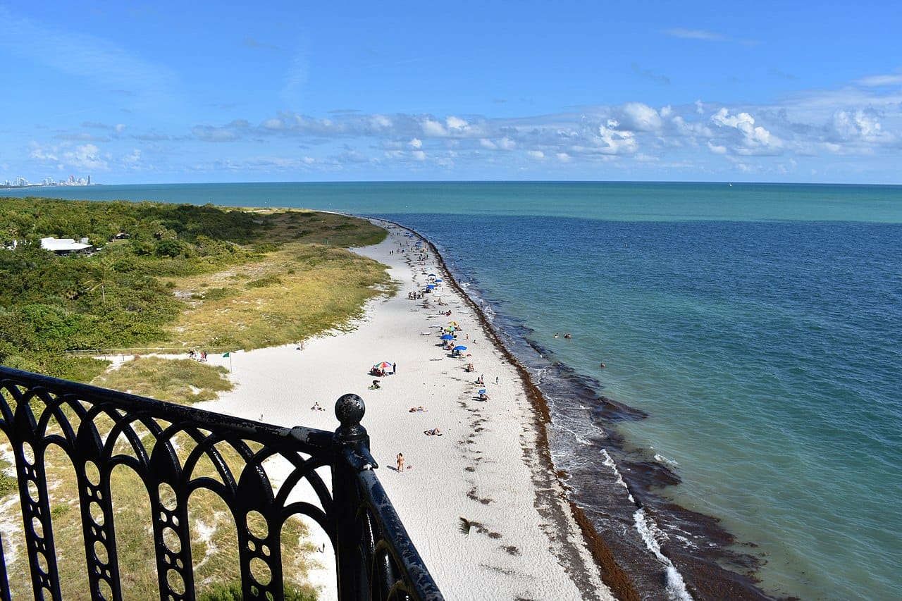 a view of the beach from the top of the lighthouse