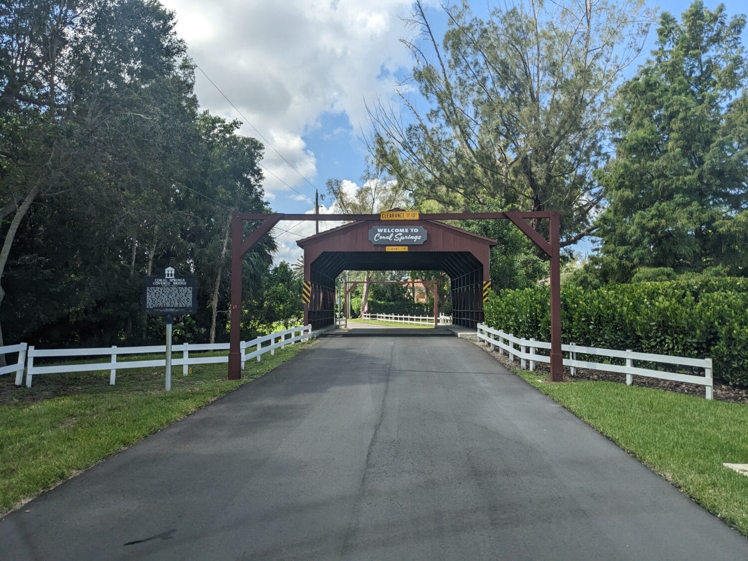 a wide shot of the bridge with the welcome sign of Coral Springs