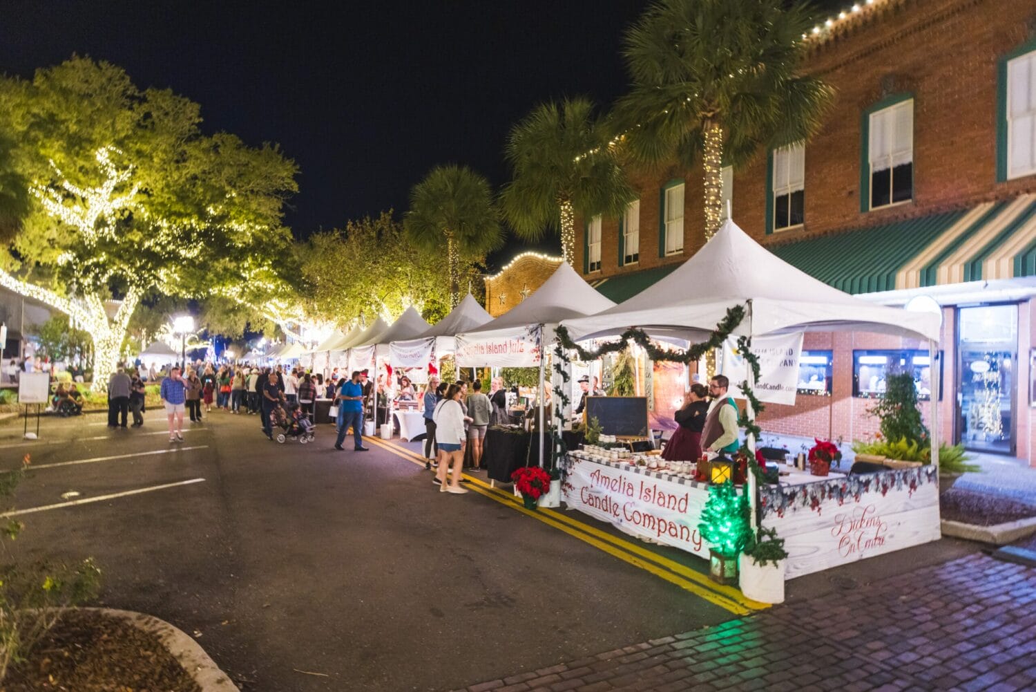 An array of festive Christmas stalls with a variety of vendors selling holiday treats, decorations, and gifts