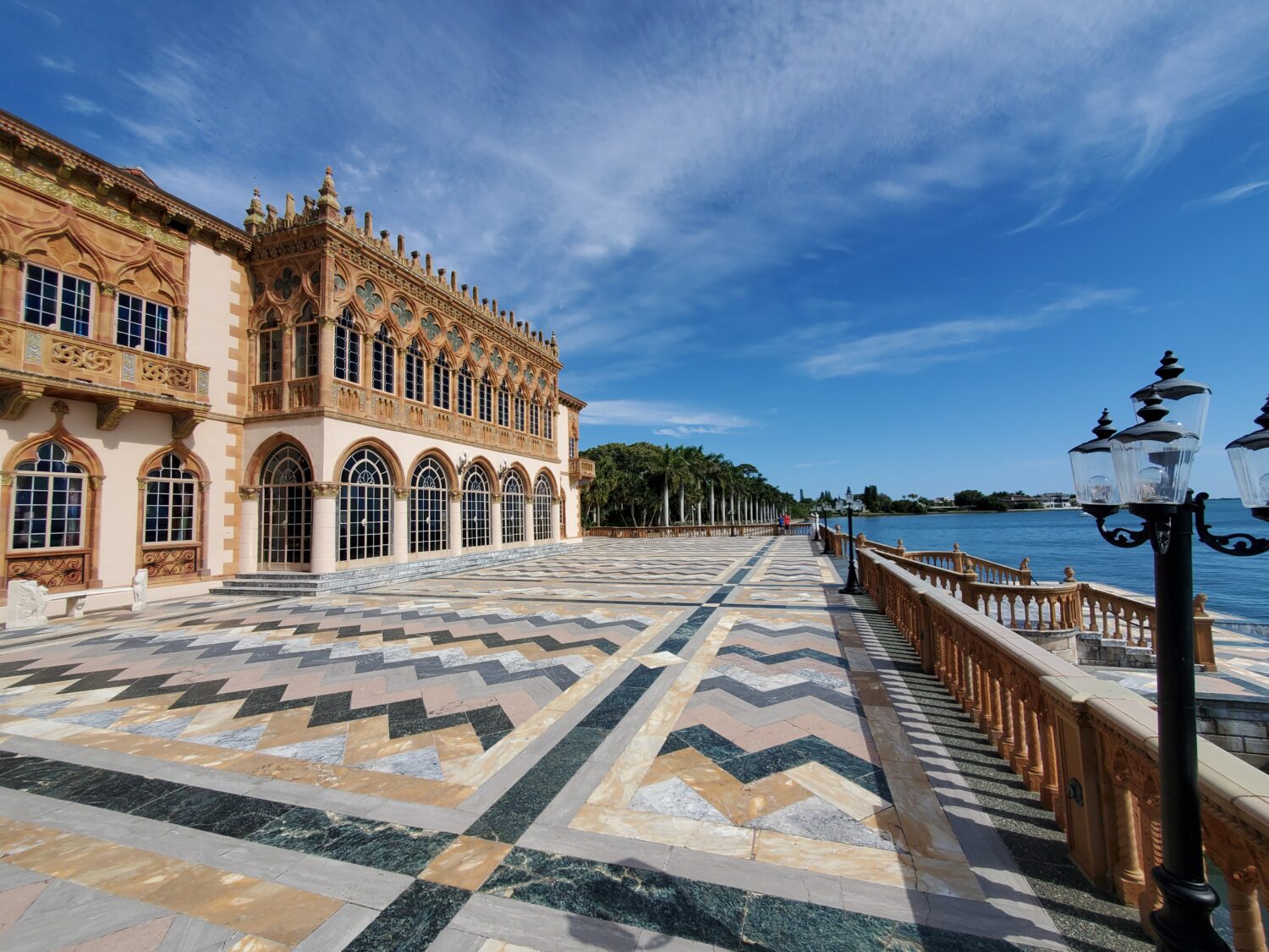 an image of the john and mable ringling museum of art that is facing the waters