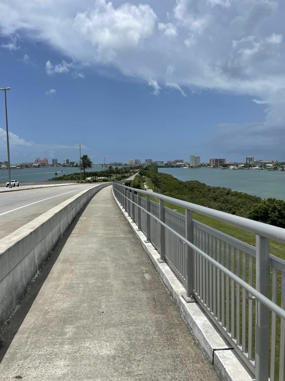 an image of the memorial causeway bike trail taken on a clear weather with views of the sea and the city