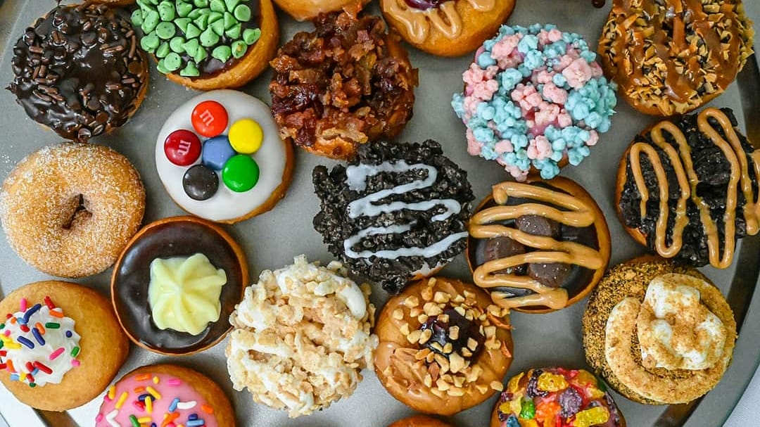 Colorful mini donuts with various toppings.