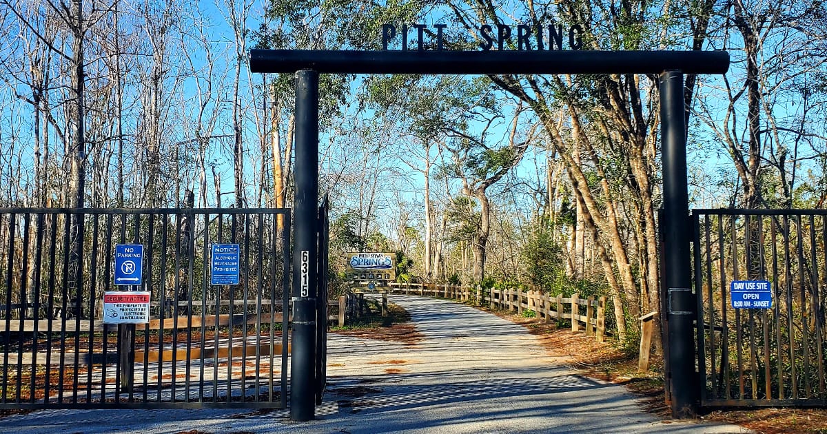 entrance to the spring with signages and notices on the rails