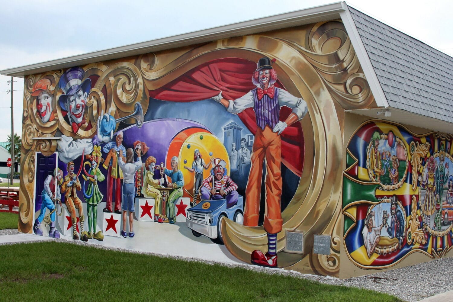 Exterior of american clown museum painted with clown murals