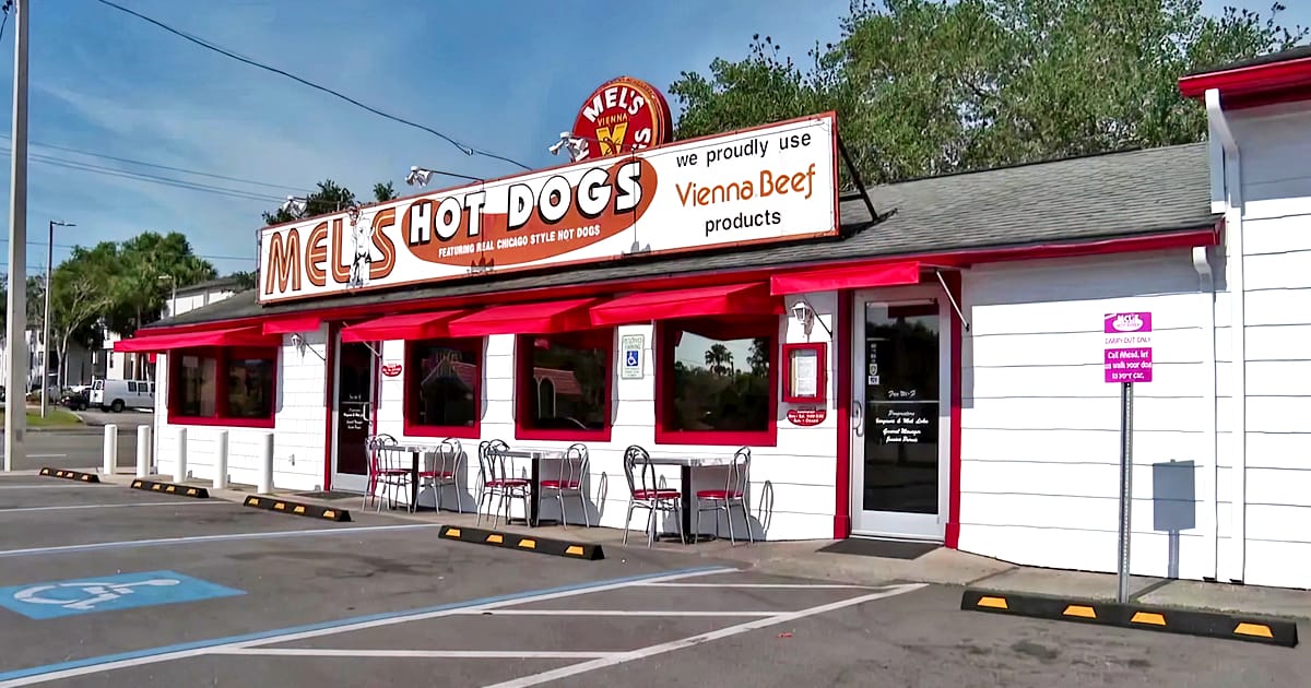 mel's hotdogs with a bold red and white exterior, advertising chicago style hot dogs and vienna beef products