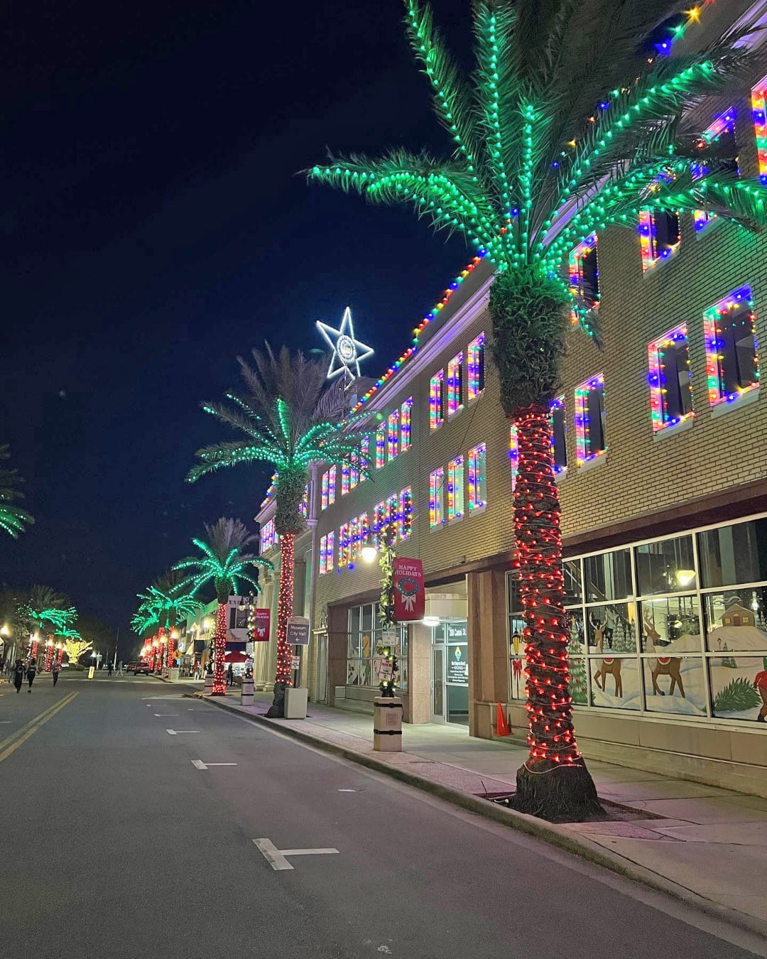 the bright canal street in new smyrna beach lights up the night with spectacular arrangement of holiday lights