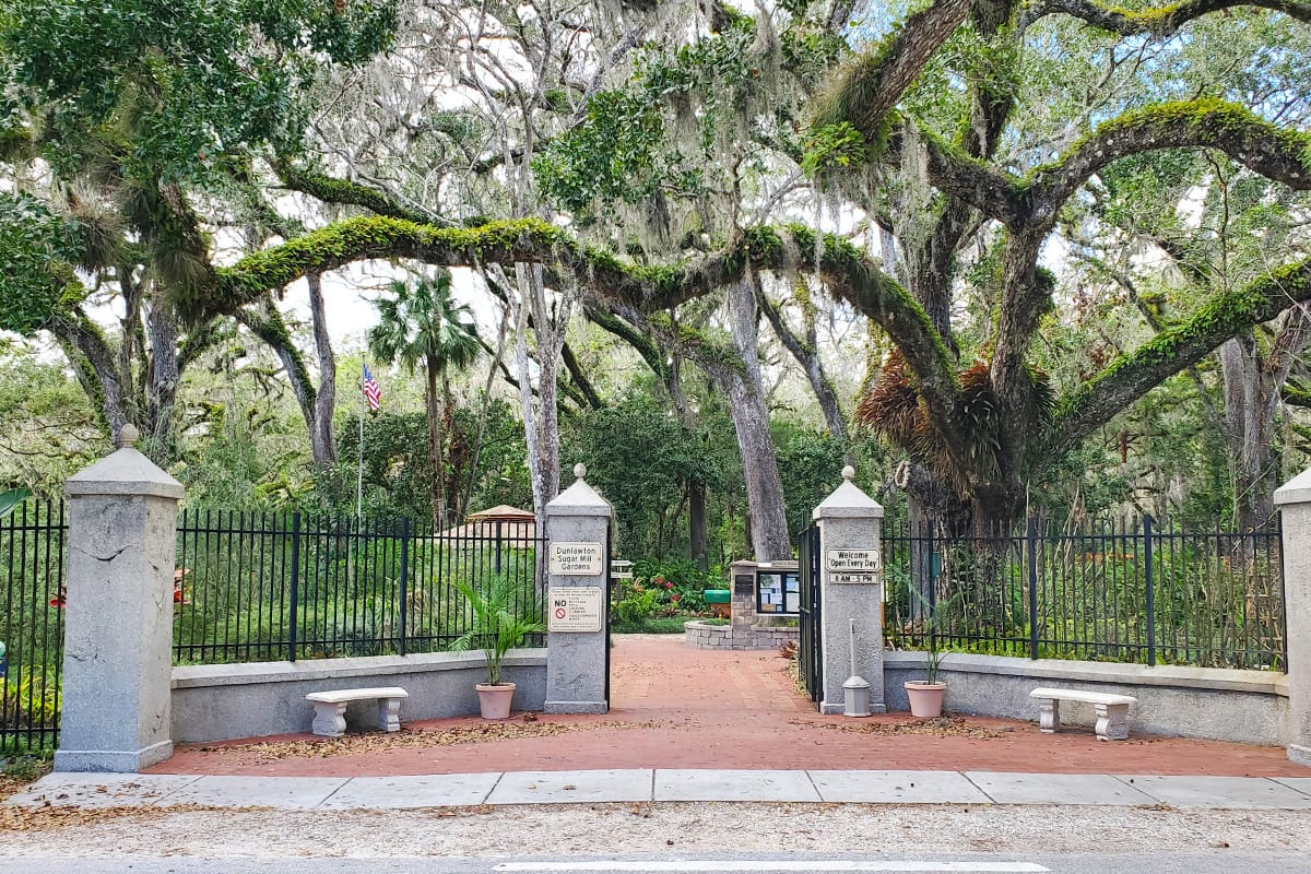 The entrance to Dunlawton Sugar Mill Gardens overlooking the enchanting trees.