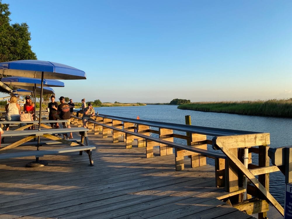 the outdoor dining during sunset with a view of the river