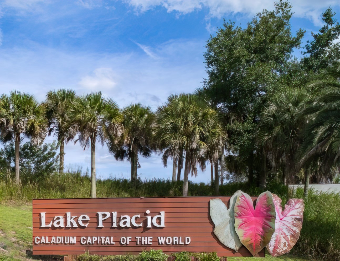 welcome sign of lake placid florida with trees in the background