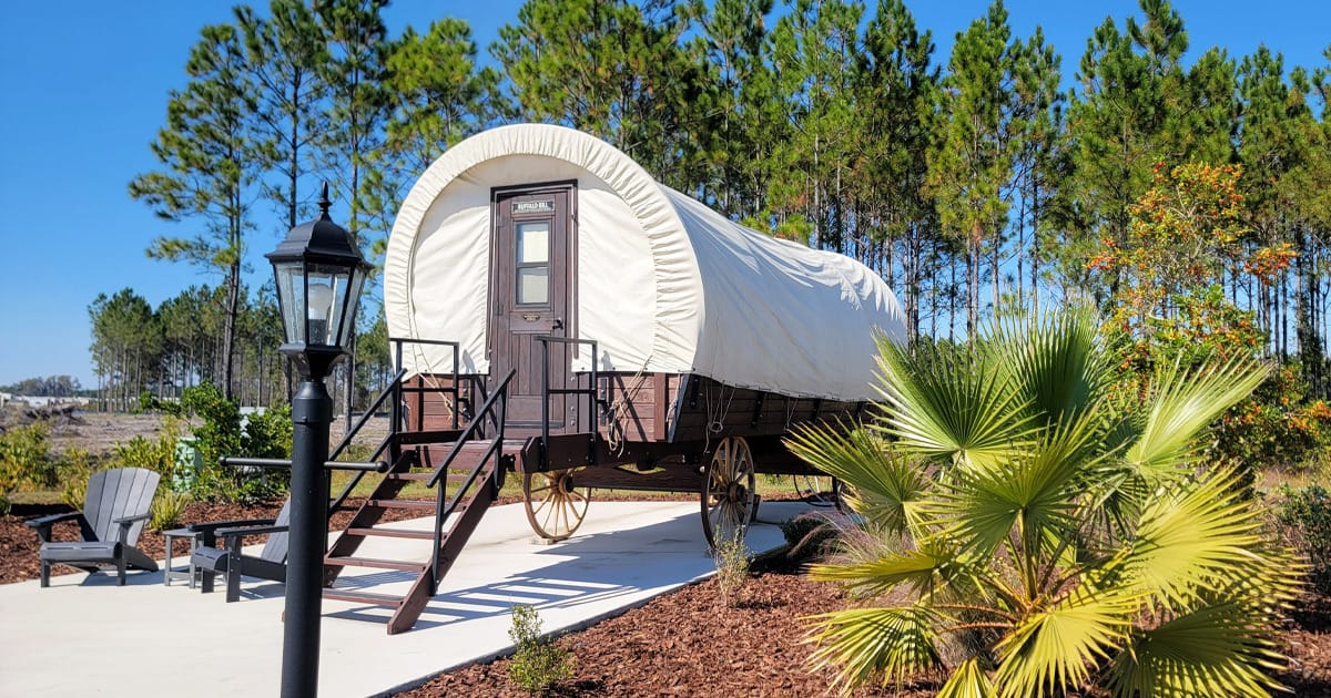 a modern classic covered wagon in keystone heights rv resort, set up as a unique lodging option
