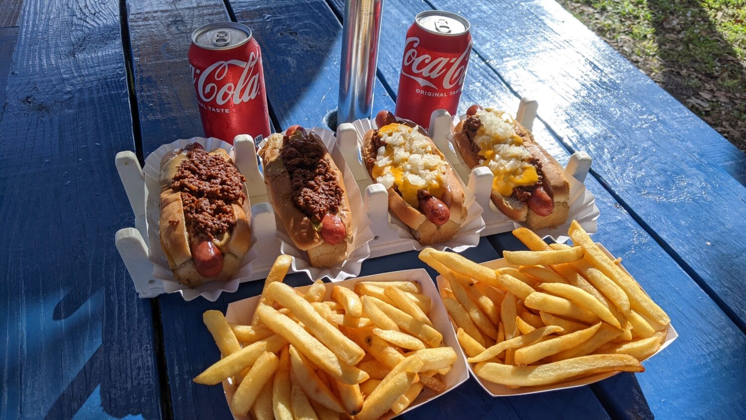 chili dogs with crispy fried fries and drinks