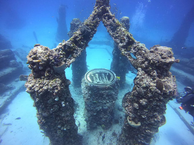 explore an underwater cemetery that doubles as an artificial reef