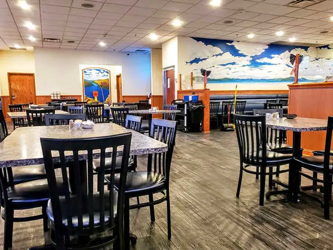 Step inside to discover a cozy interior where wooden tables and warm lighting create the perfect backdrop for food that'll make you want to hug the chef.