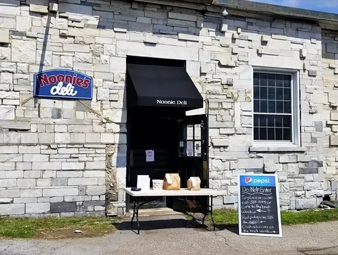 A charming stone facade that looks like it was plucked from a Vermont postcard—complete with that classic small-town deli charm.
