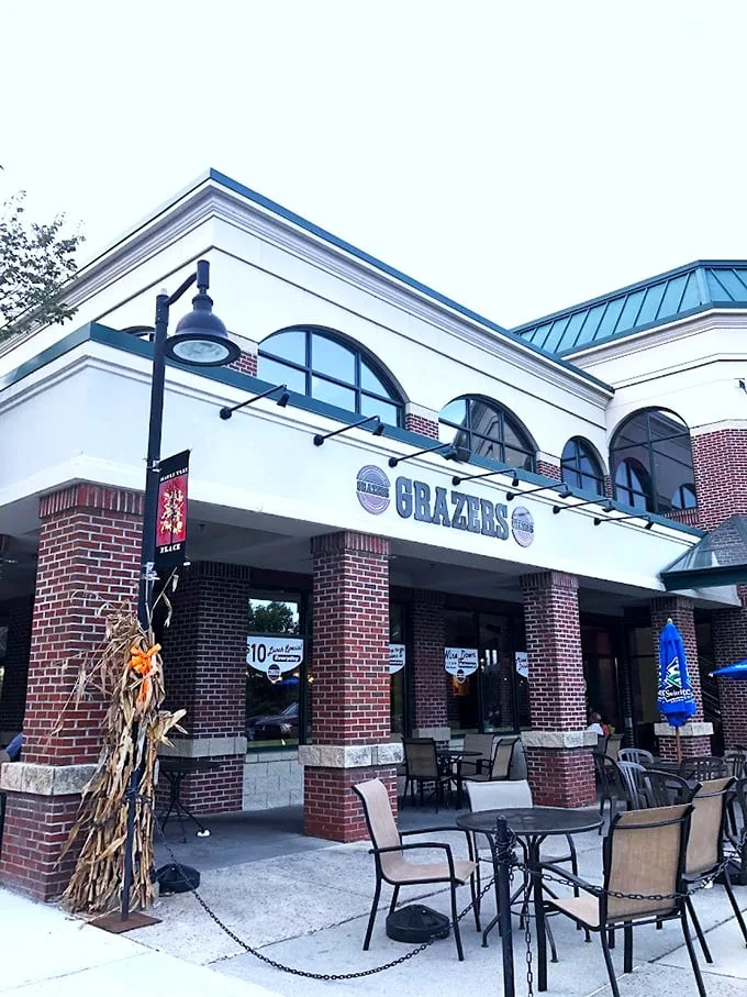 The bold signage of Grazers stands proudly against Vermont's sky, promising comfort food with modern flair in this welcoming Williston spot.