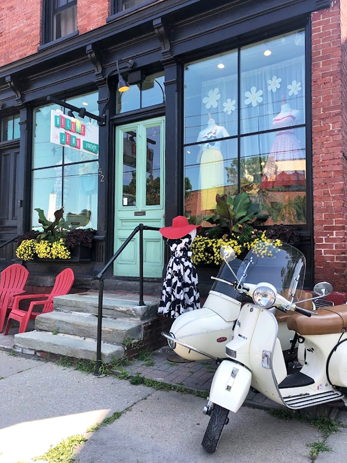 Step into a time machine disguised as a storefront! Billie Jean Vintage's mint-green door beckons you to explore decades of fashion treasures.