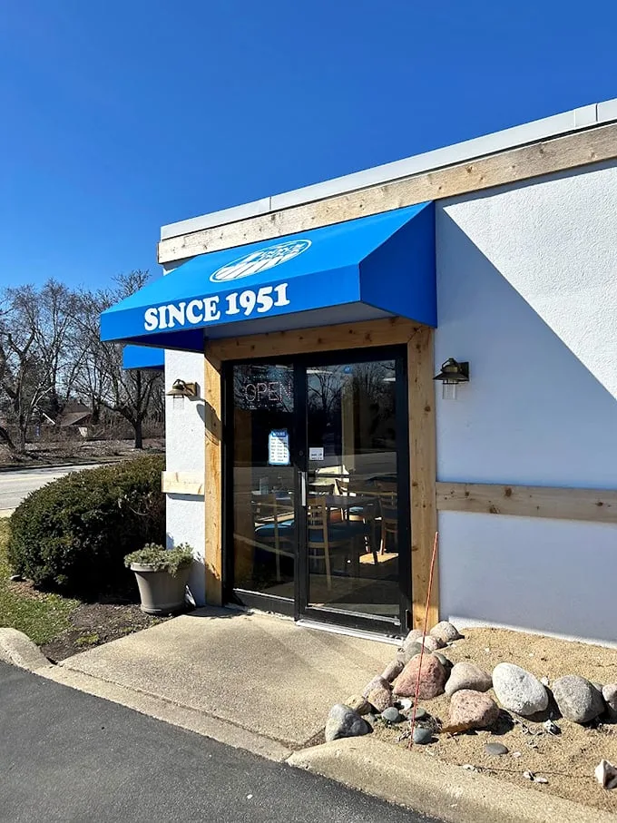 Welcome to seafood paradise! Don's Dock's bright blue awning beckons like a lighthouse, guiding hungry sailors to a harbor of deliciousness.