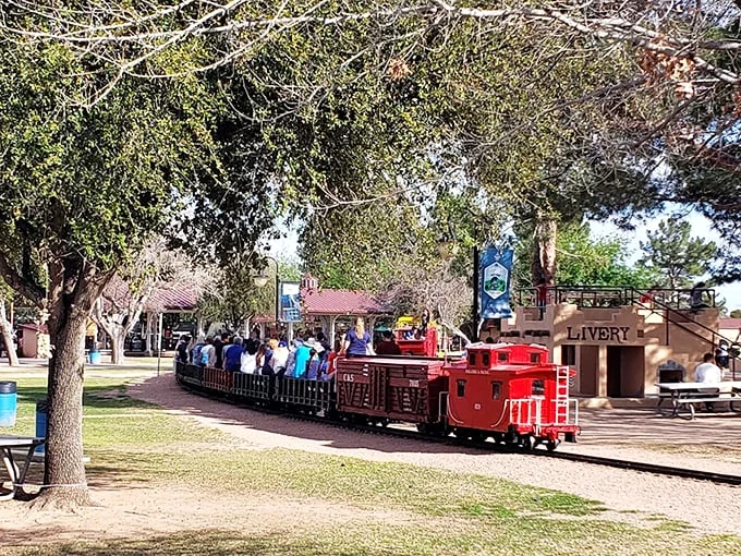 All aboard the nostalgia express! This mini-locomotive isn't just whistling Dixie—it's carrying a cargo of joy through McCormick-Stillman Railroad Park.