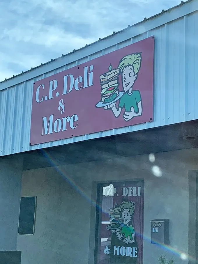 Welcome to sandwich paradise! CP Deli's sign promises "& More," and boy, do they deliver. Get ready for a flavor adventure.