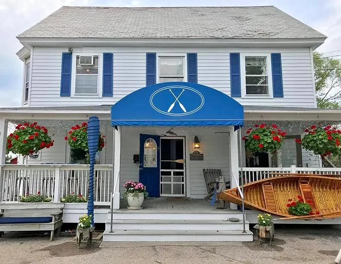 Welcome to the Blue Paddle Bistro, where charm meets cuisine! This quaint white house with blue trim could easily be mistaken for your favorite aunt's summer cottage.