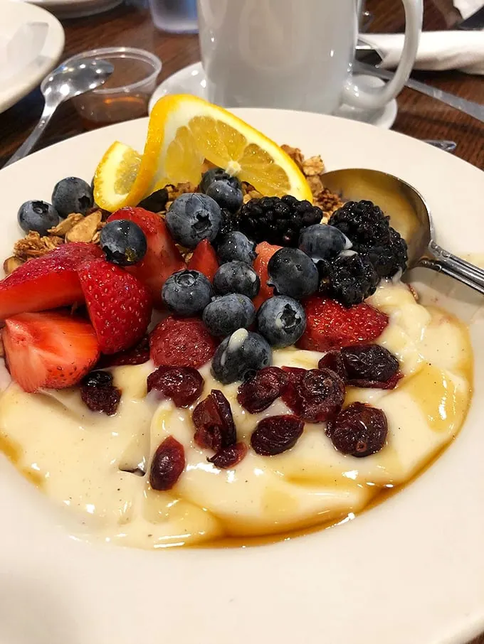 A breakfast bowl that's both virtuous and indulgent—fresh berries, creamy yogurt, and granola living in perfect harmony.