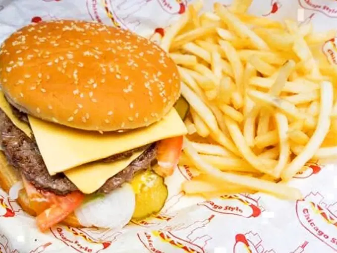 Cheese, please! This burger is stacked with flavor and paired with fries so perfect they deserve their own fan club.